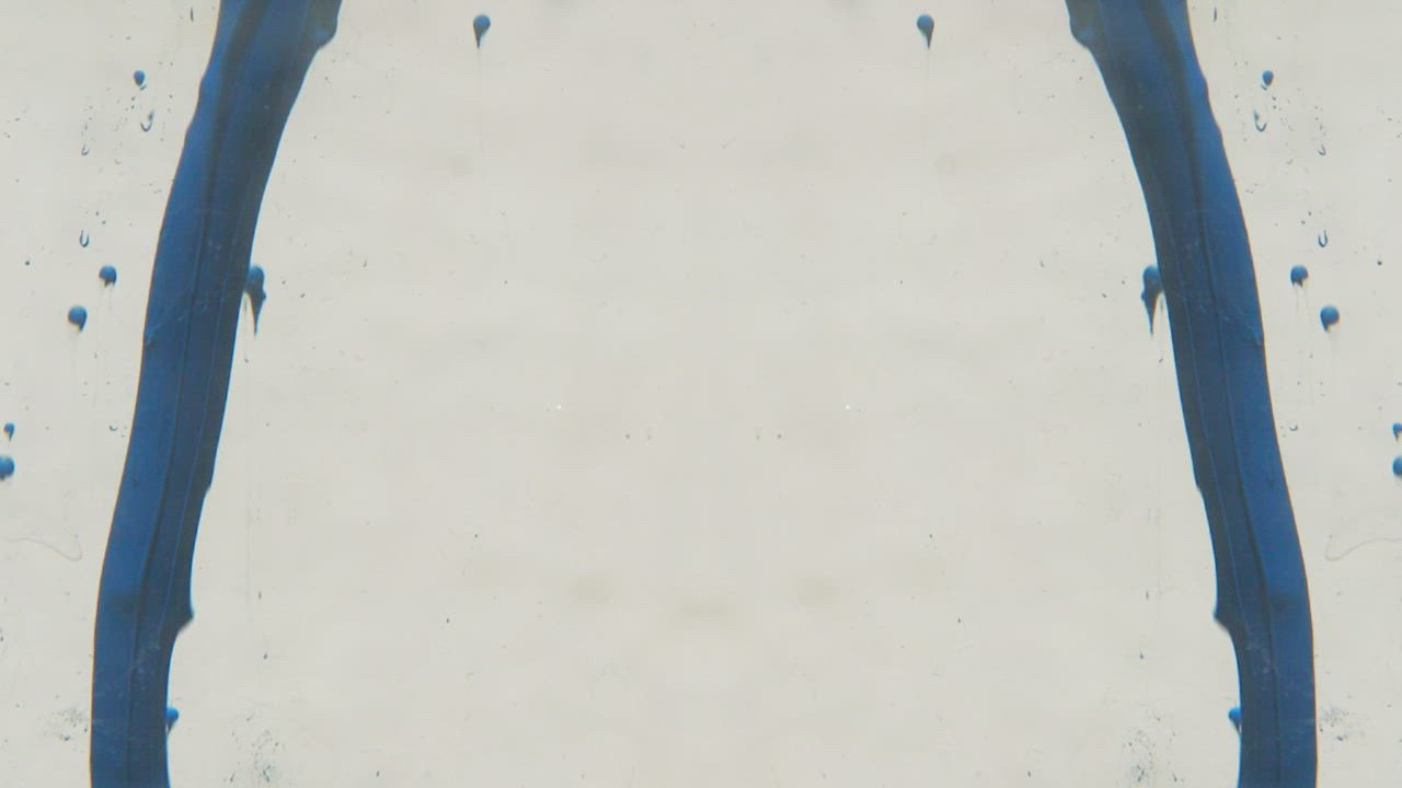 Blue ink flow descending underwater - Free Stock Video
