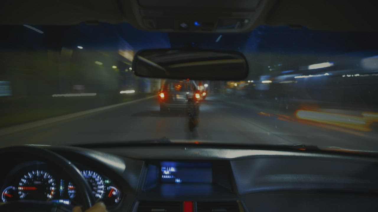 View from inside a car in night traffic - Free Stock Video
