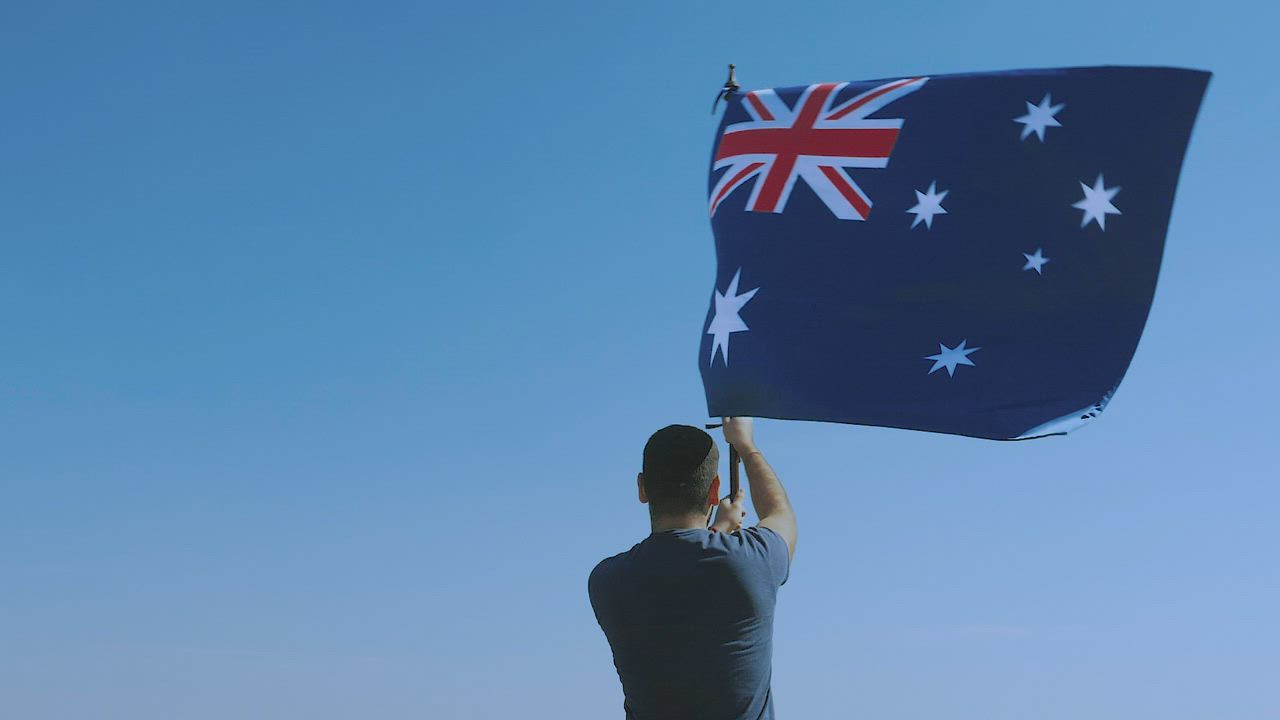 Man proudly waving the Australian flag - Free Stock Video