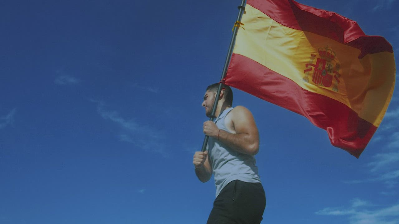 Man running with Spanish flag - Free Stock Video