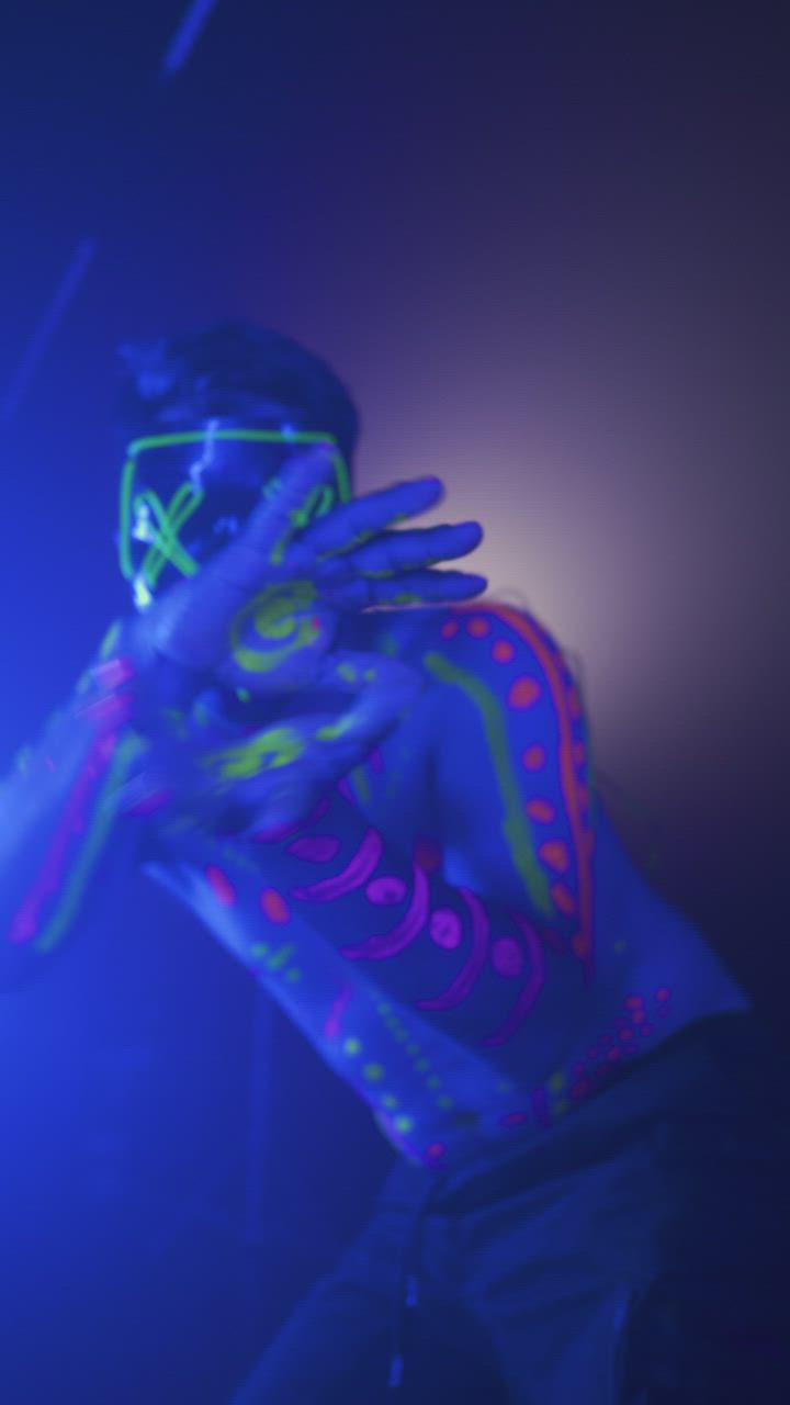 Man with mask dancing in front of the camera - Free Stock Video