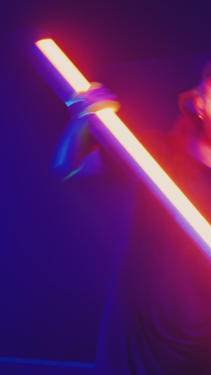 Urban dancer dancing with a light bar in his hands - Free Stock Video