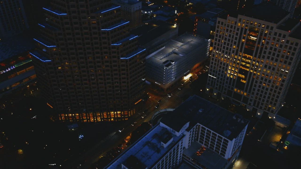 Movement in a city at night in an aerial shot - Free Stock Video