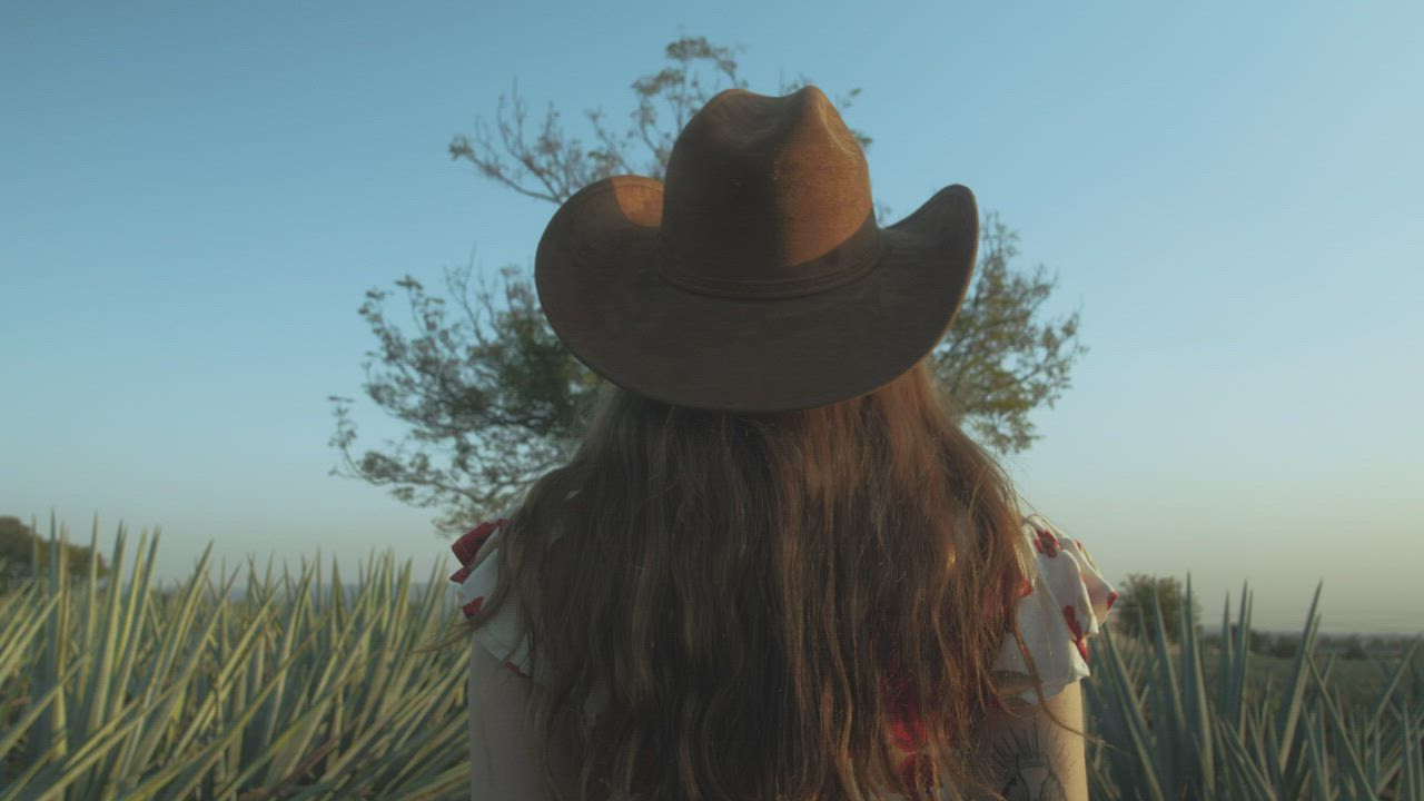 Girl with Mexican style walking through a ranch - Free Stock Video