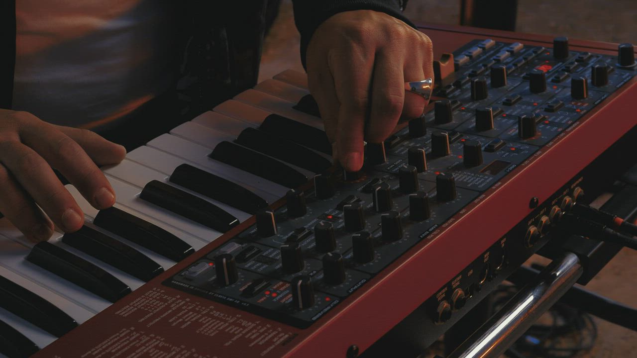 Hands of a DJ playing a keyboard - Free Stock Video