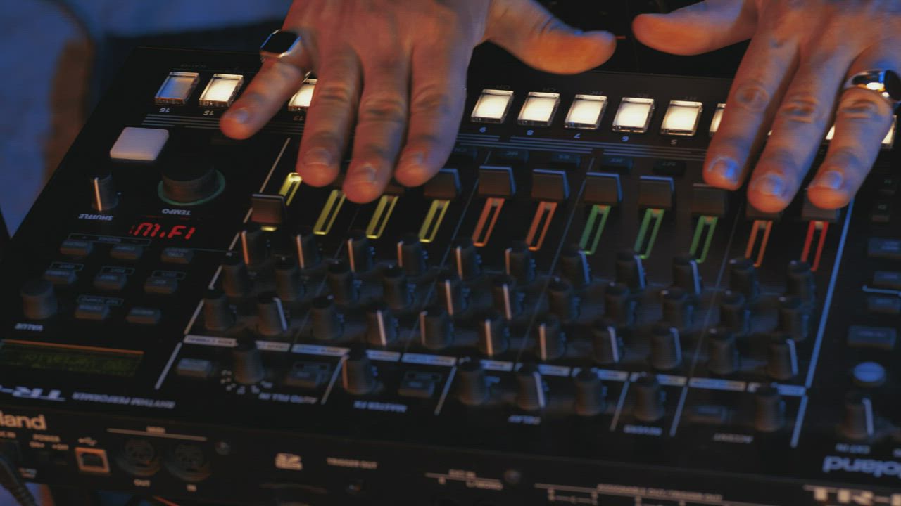 Close-up view of the hands of a DJ using a console - Free Stock Video
