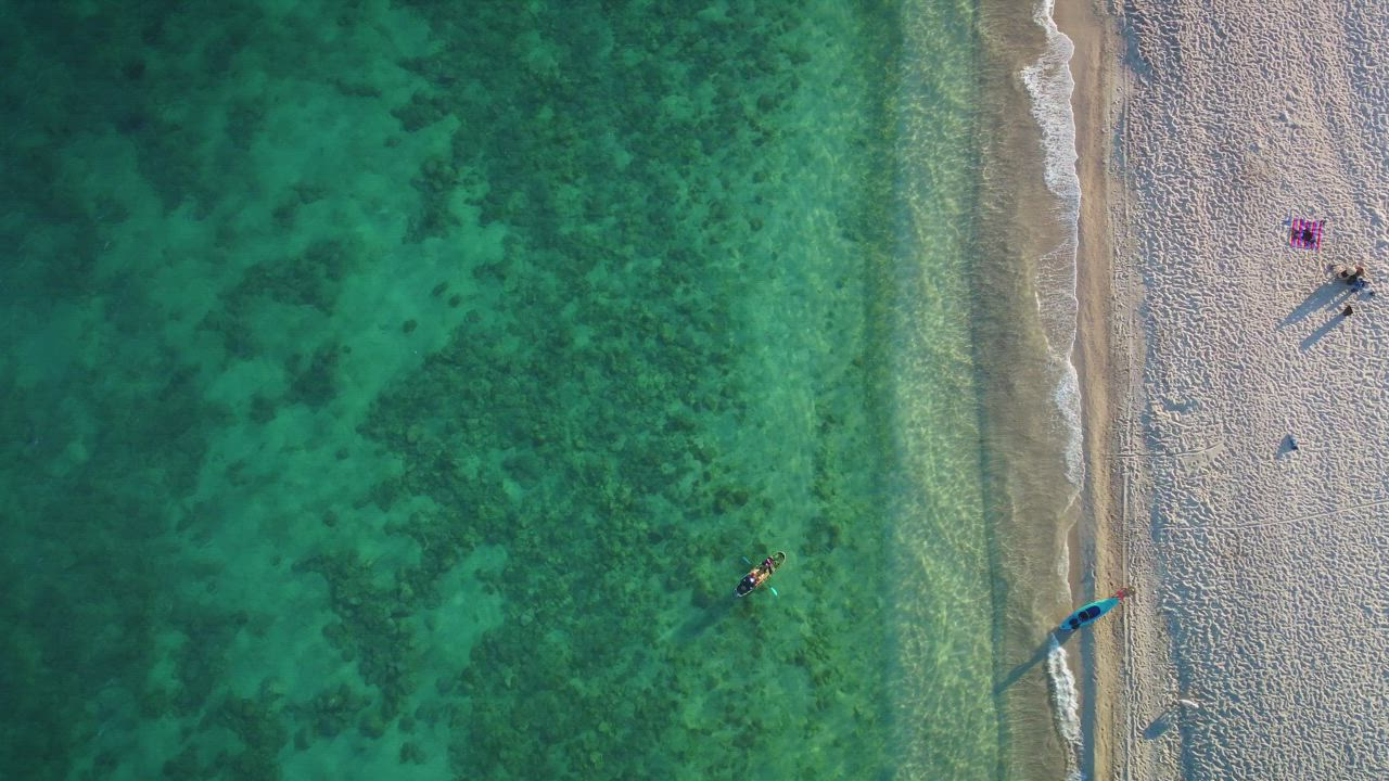Beach and sea from a shot high up in the air - Free Stock Video