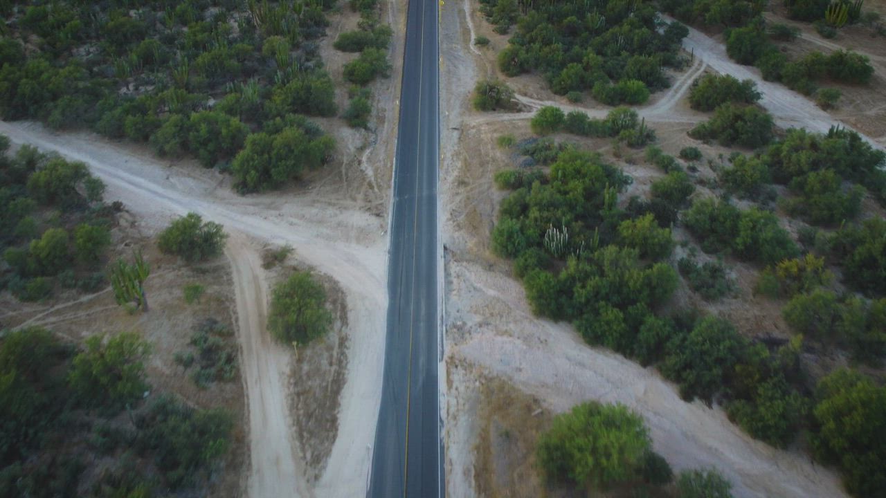 Traveling a long road from the heights - Free Stock Video