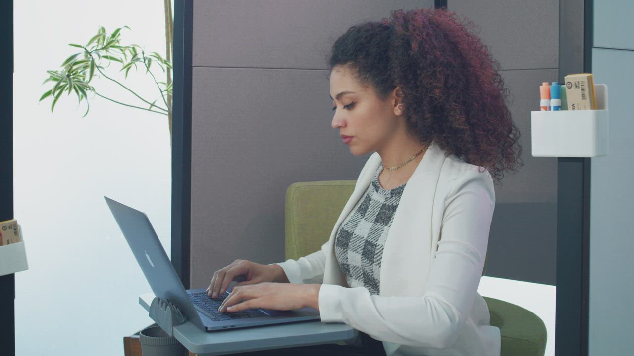 Woman working on her macbook pro - Free Stock Video