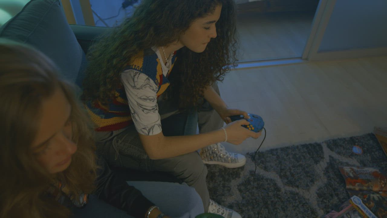 Three young friends gaming in the living room - Free Stock Video
