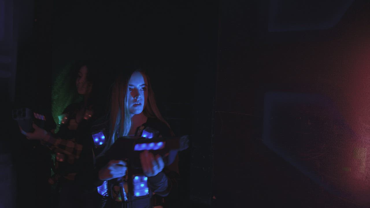 Girls looking for opponents in laser gotcha - Free Stock Video