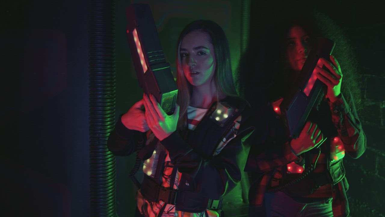 Girls posing with laser tag blasters - Free Stock Video