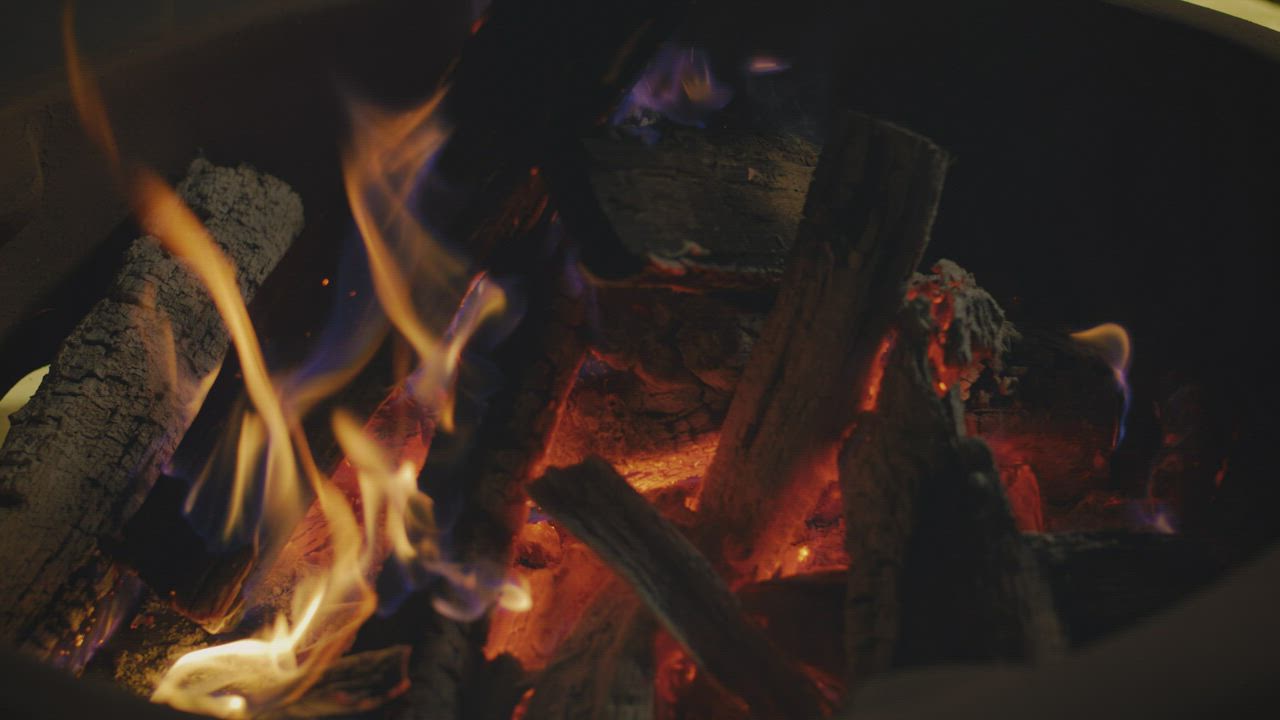 Shot near a lit campfire - Free Stock Video