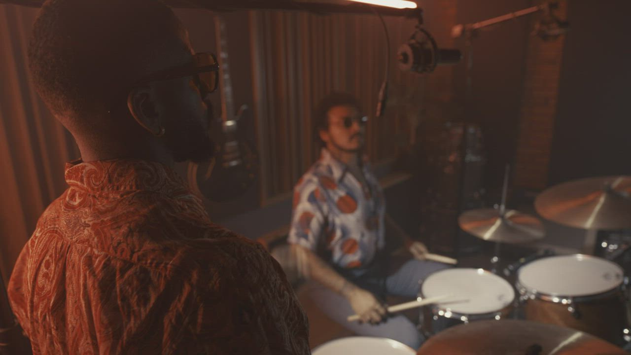 Producer making a drum set in a studio - Free Stock Video