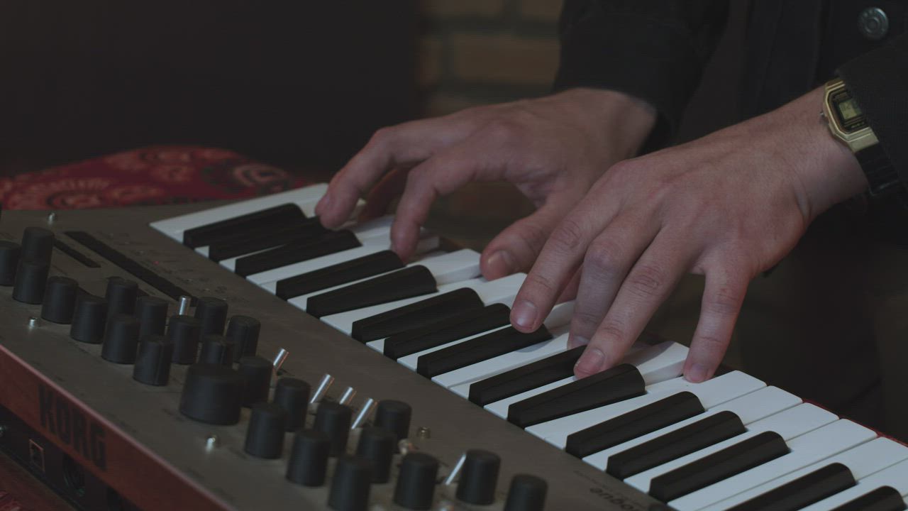 Pianist playing chords on a synthesizer - Free Stock Video