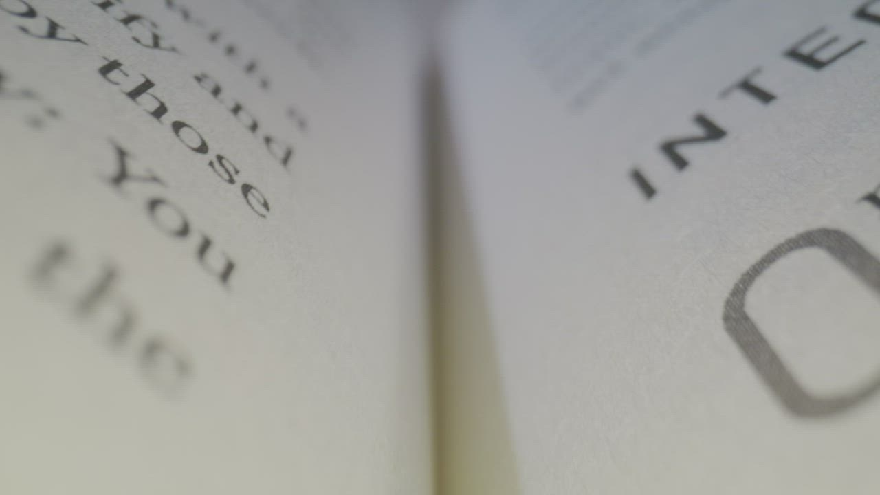 Close tour through the middle of an open book - Free Stock Video