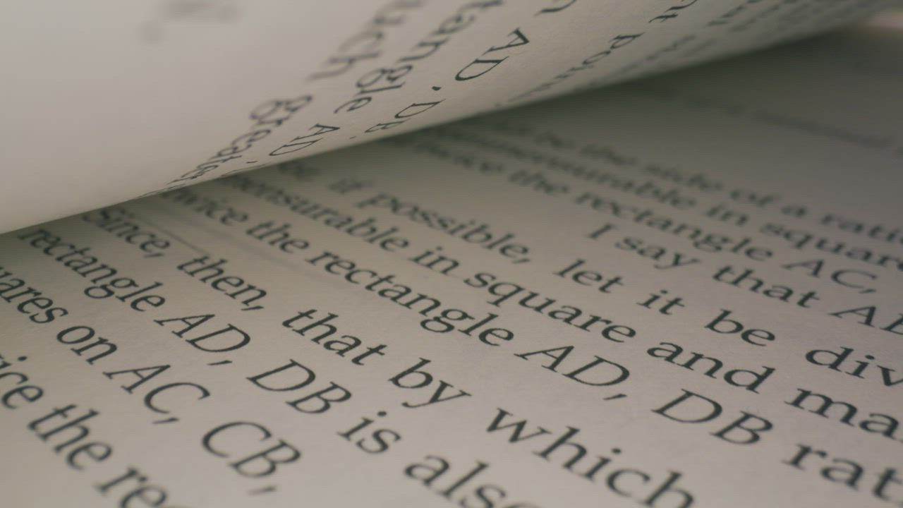 Very close shot of the pages of a book closing - Free Stock Video