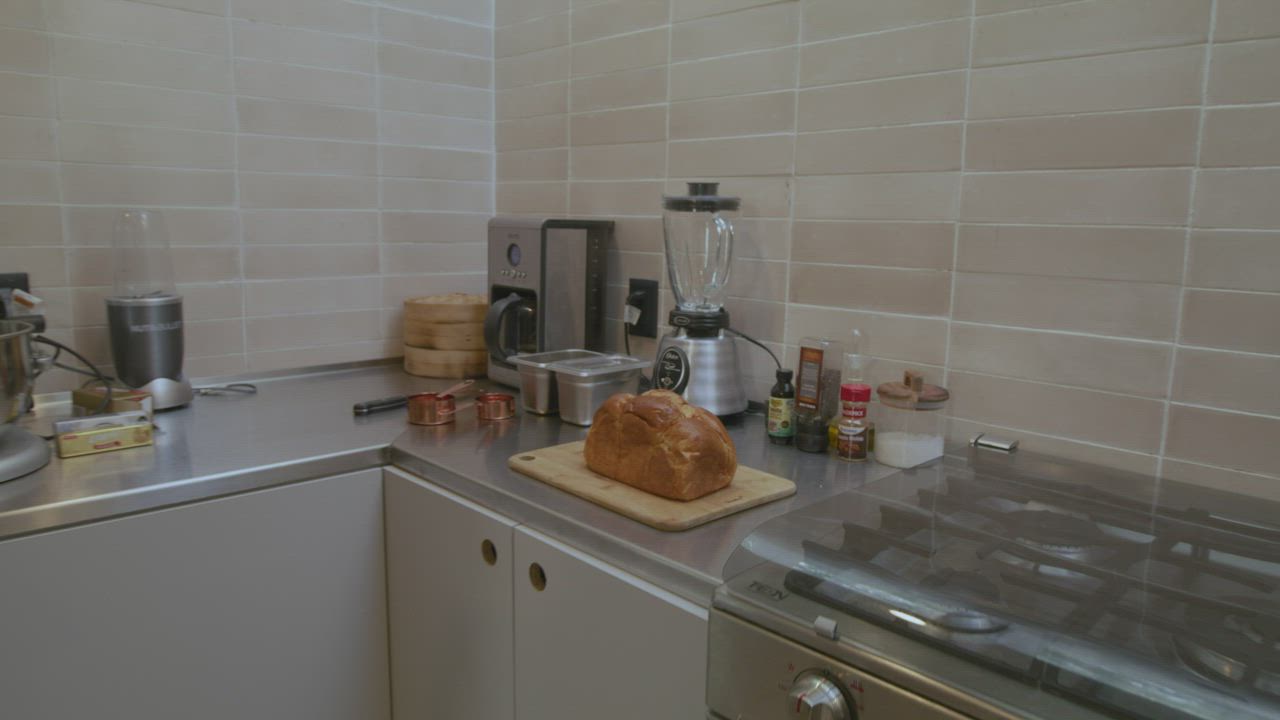 Pastry chef working in a modern kitchen - Free Stock Video
