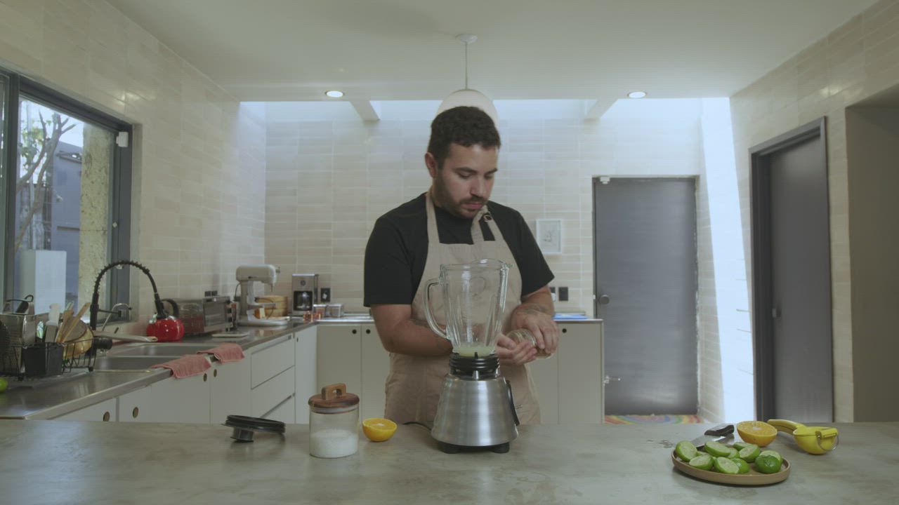 Chef adding ingredients to a blender - Free Stock Video