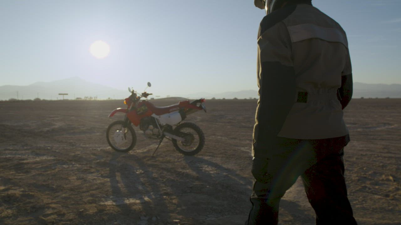 Biker walking towards his motorcycle - Free Stock Video