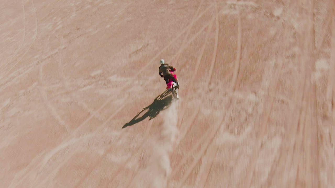 Man riding a motorcycle in the desert - Free Stock Video