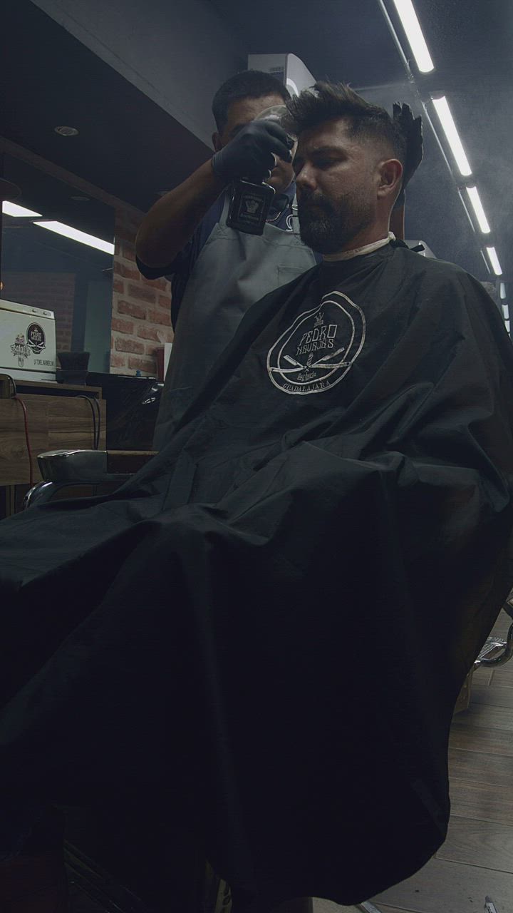 Barber spraying his client's hair - Free Stock Video