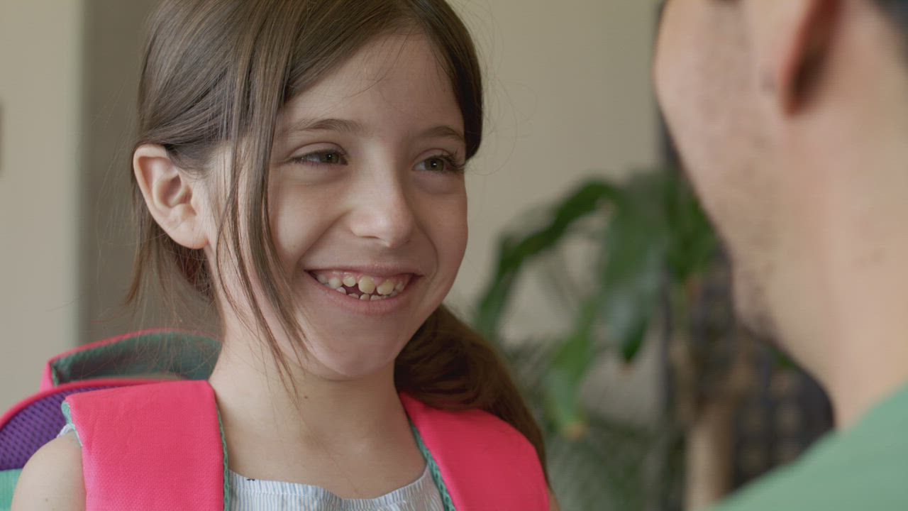 Portrait of a girl talking with her father - Free Stock Video
