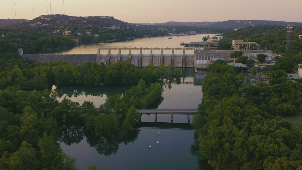 Aerial tour over a dam on a river - Free Stock Video