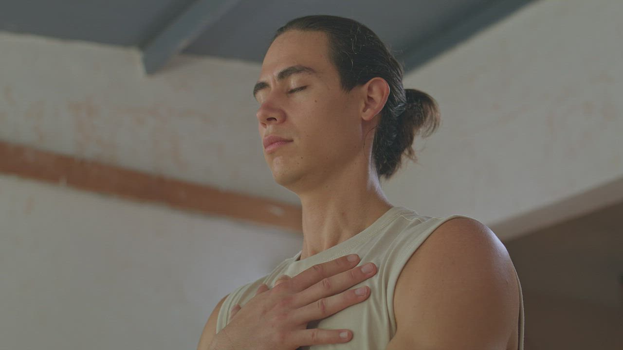 Portrait of a man breathing while meditating - Free Stock Video