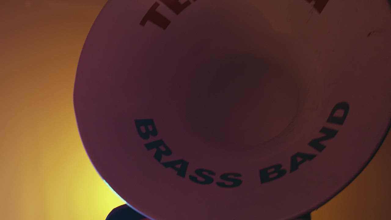 Musician playing the trombone while dancing - Free Stock Video