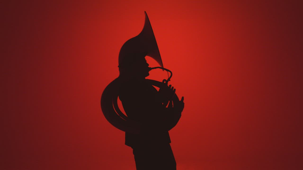 Shadow of a musician playing the trombone - Free Stock Video