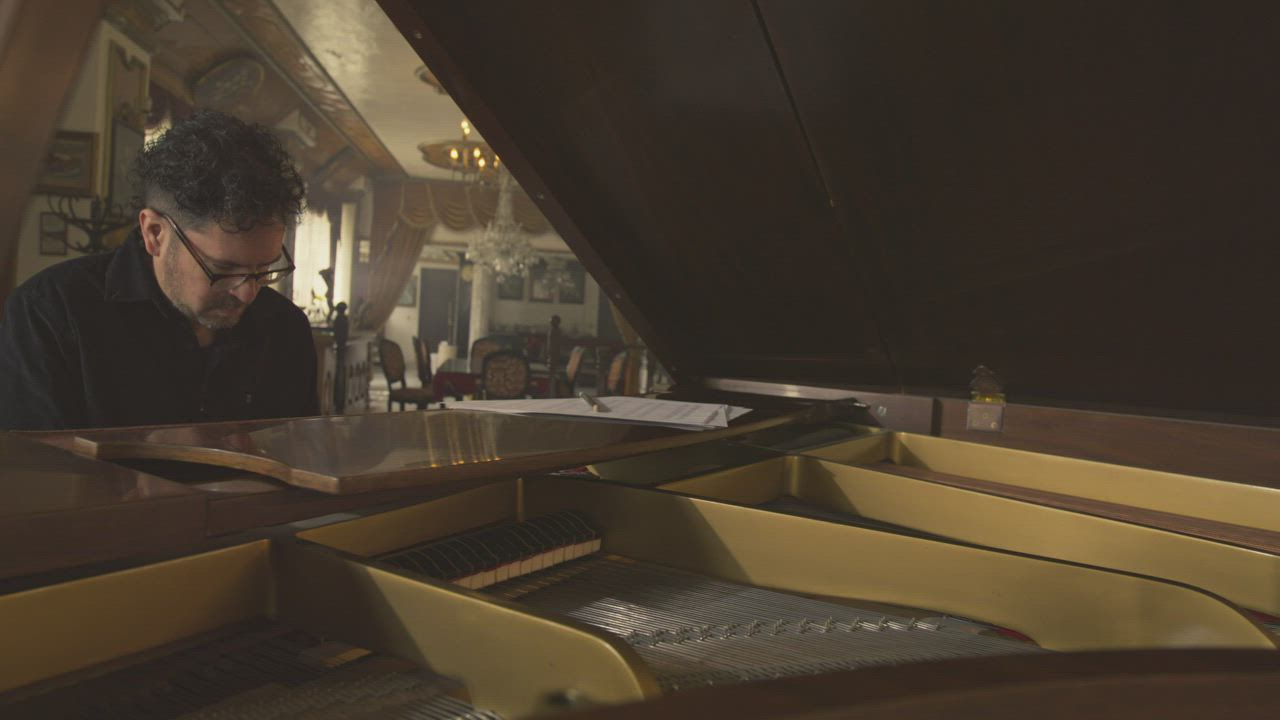 Pianist playing in an elegant hall - Free Stock Video