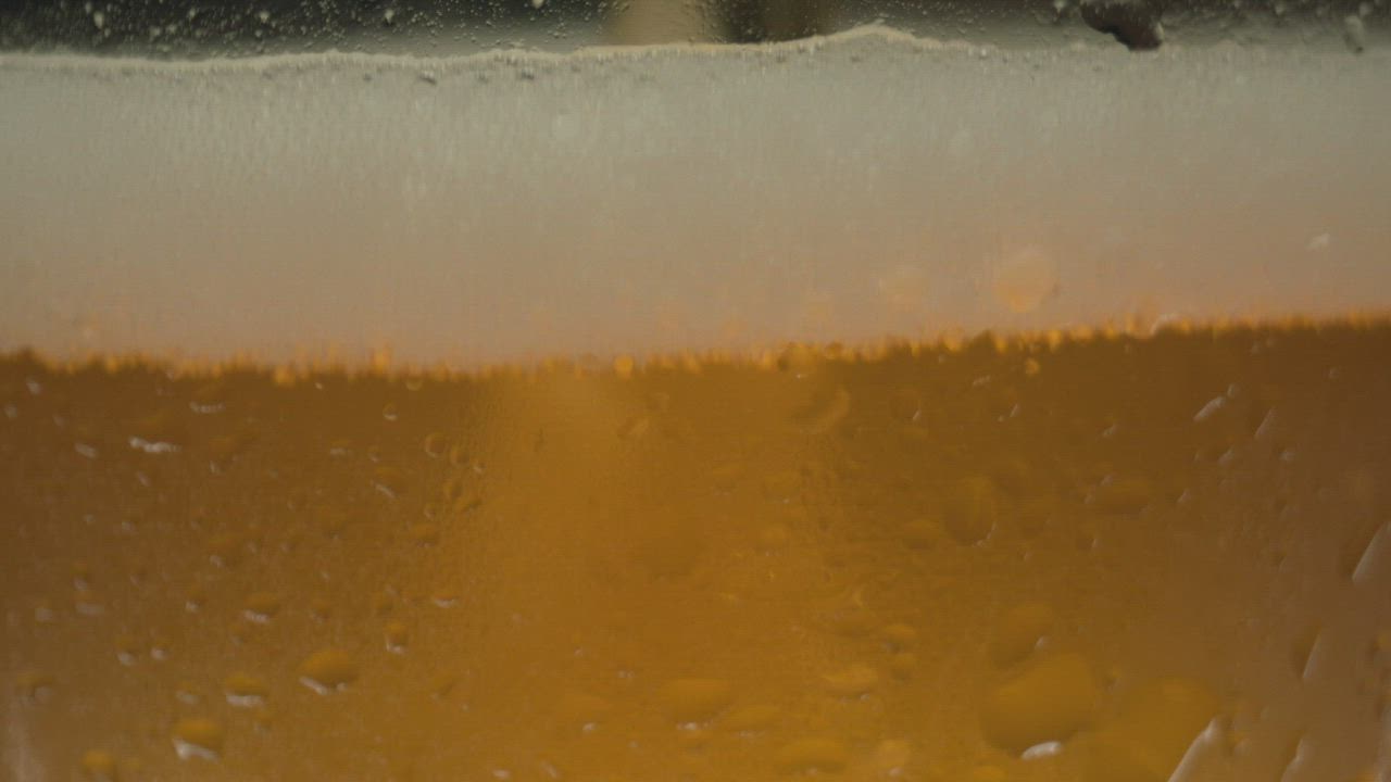 Texture of beer being served in a glass - Free Stock Video