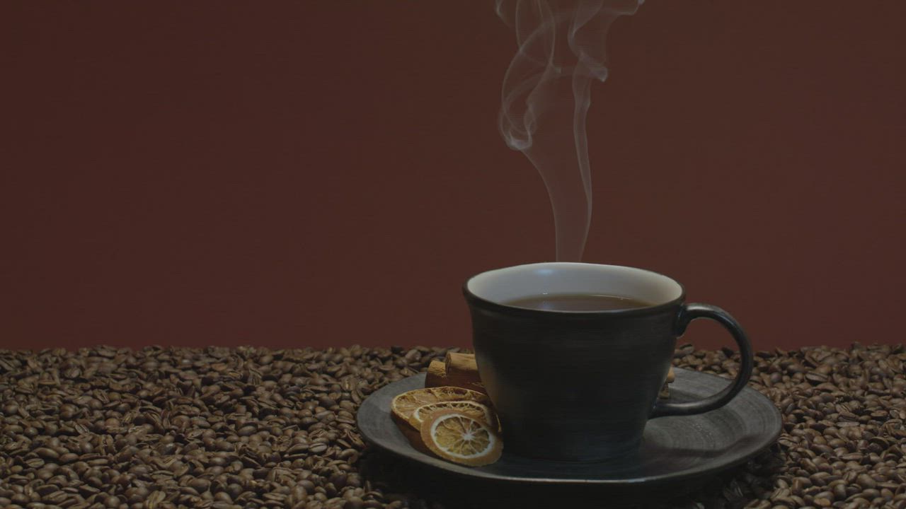 Demonstration video of a steaming cup of coffee - Free Stock Video