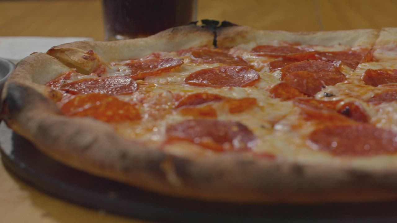 Pepperoni pizza in a close up shot - Free Stock Video