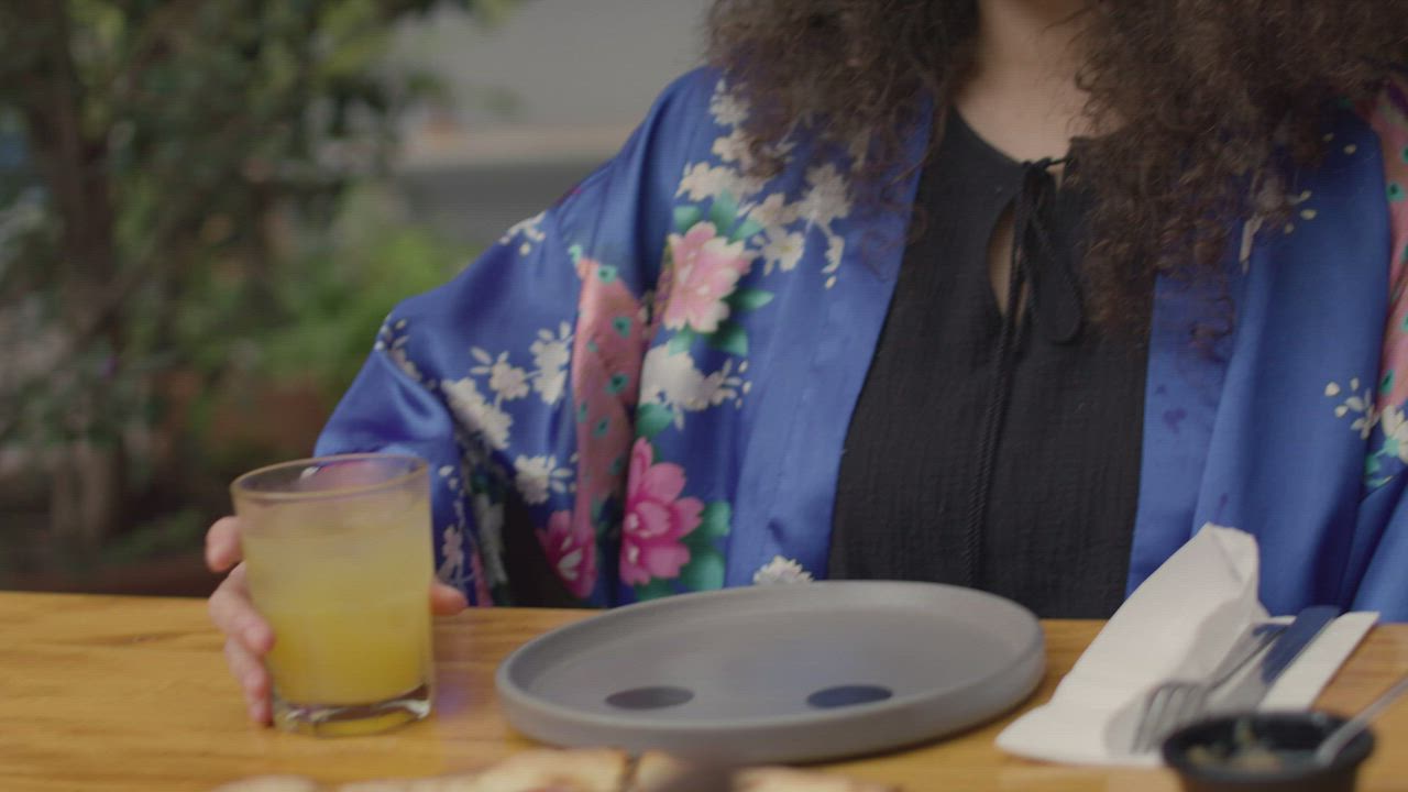 Young woman making a toast with a man - Free Stock Video