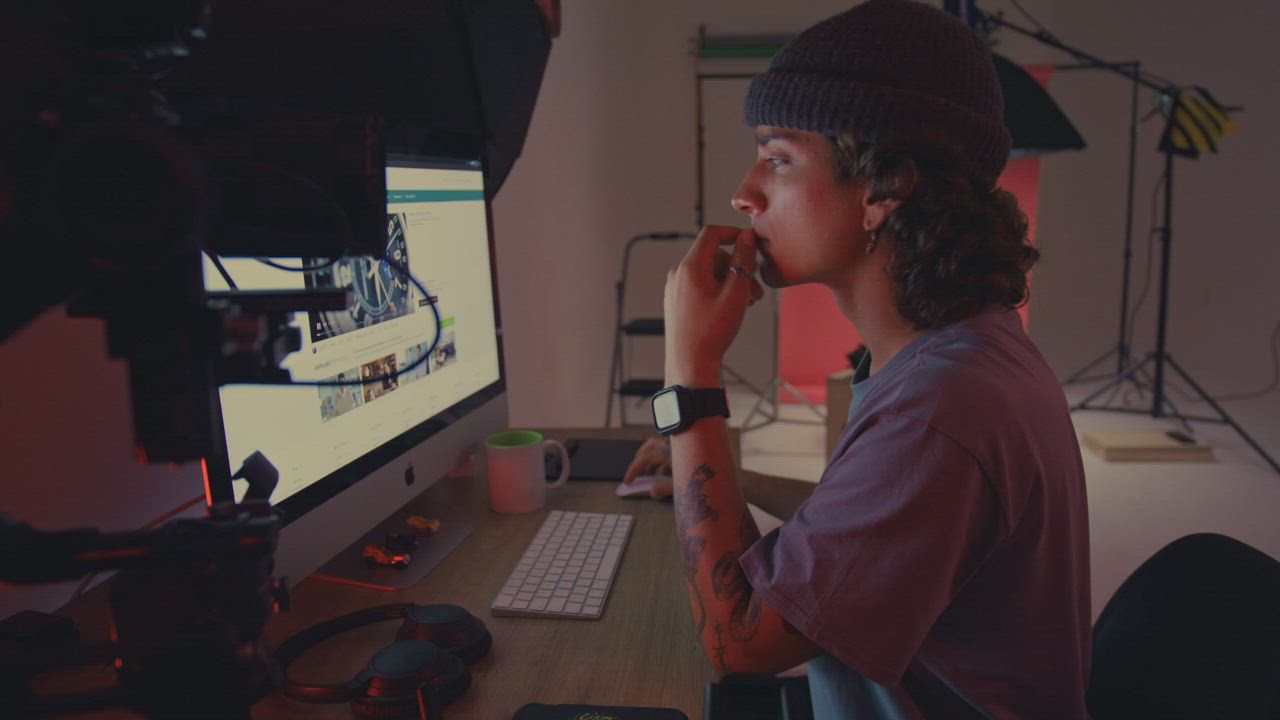 Boy working on his computer in a video studio - Free Stock Video