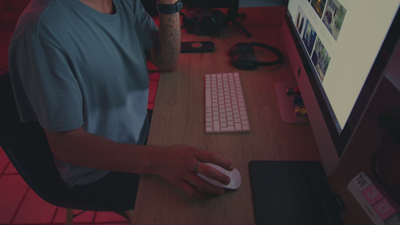 Young man working in front of a computer - Free Stock Video