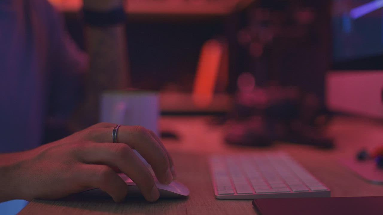 Close shot of a guy editing a video on a computer - Free Stock Video