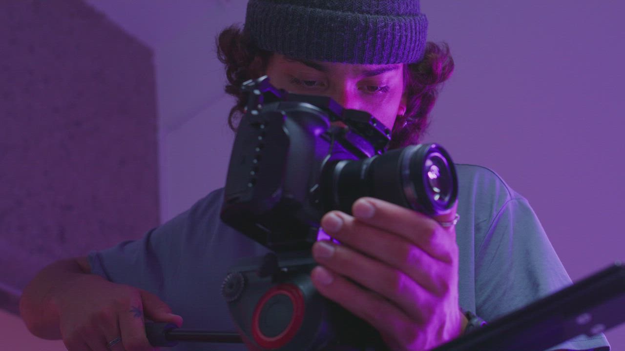 Boy recording a video with a camera on a set - Free Stock Video