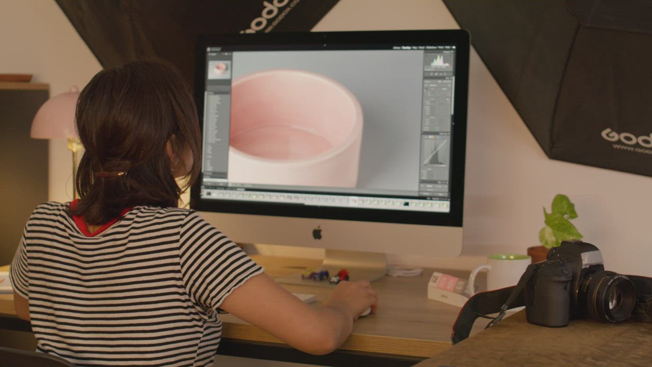 Photographer woman editing a photo on the computer - Free Stock Video