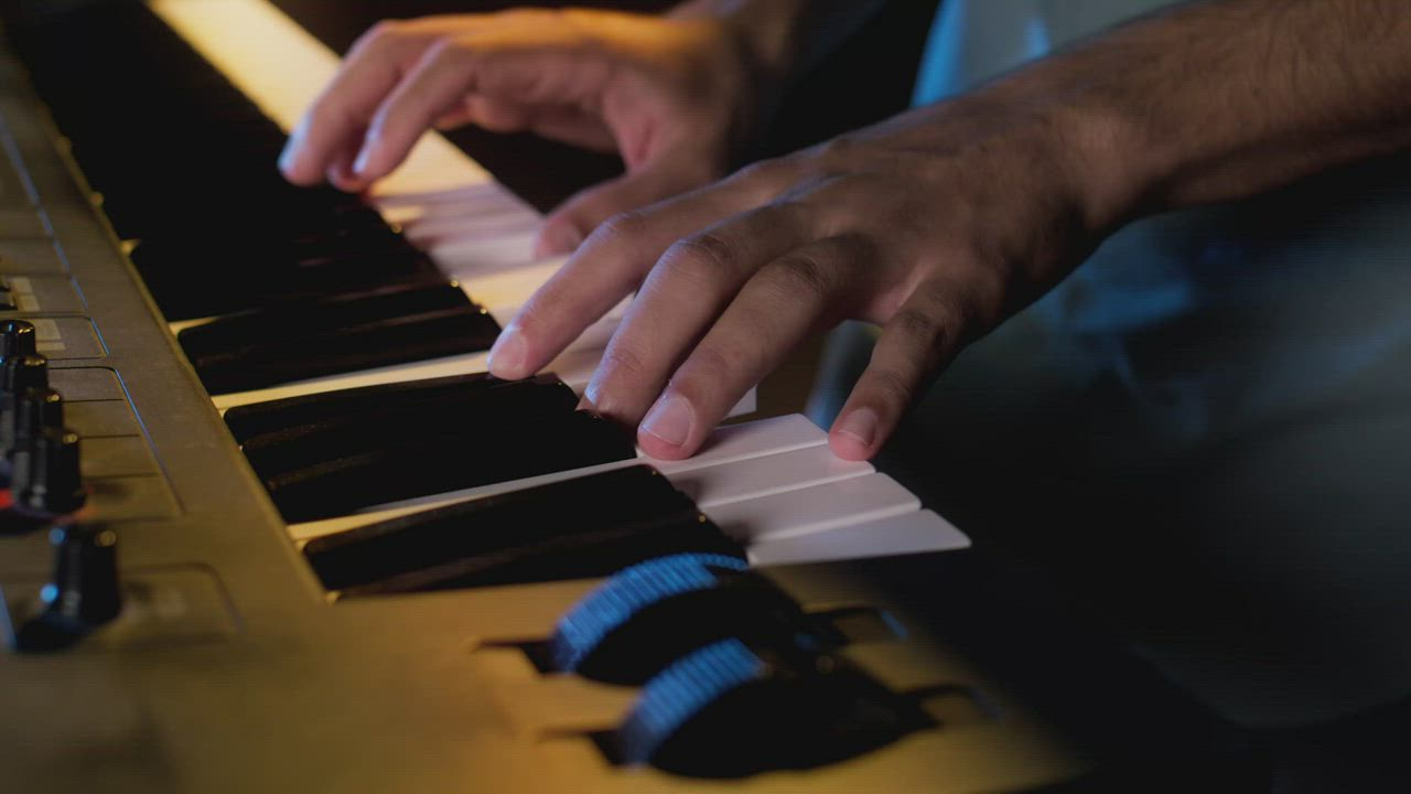 Close view of a keyboard player's hands playing - Free Stock Video