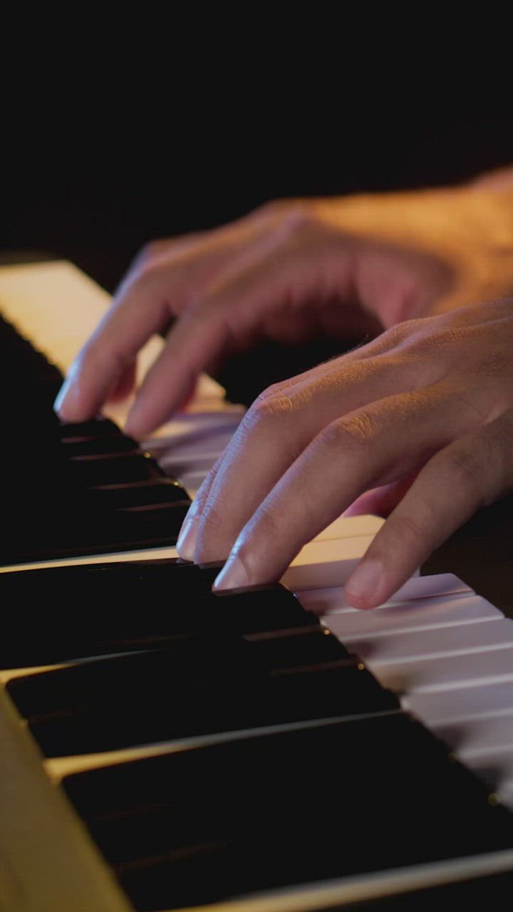 Hands of a pianist playing a keyboard - Free Stock Video