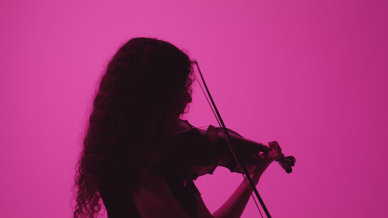 Silhouette of a female fiddler playing on a pink background - Free ...