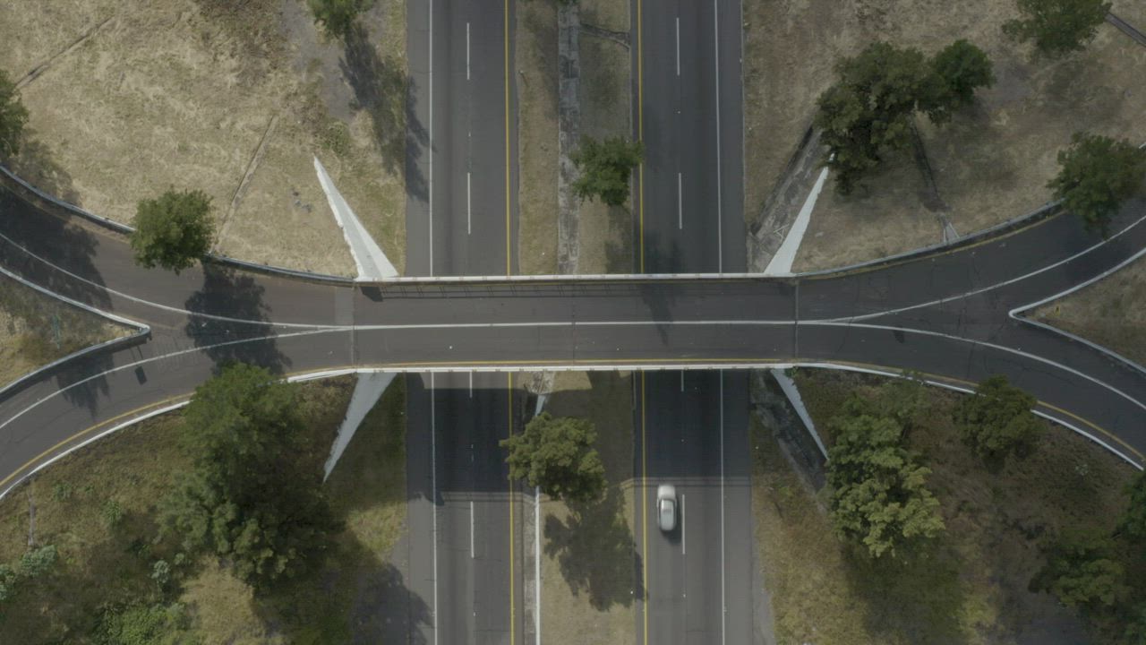 Turnaround bridge on a highway in a shot from above - Free Stock Video