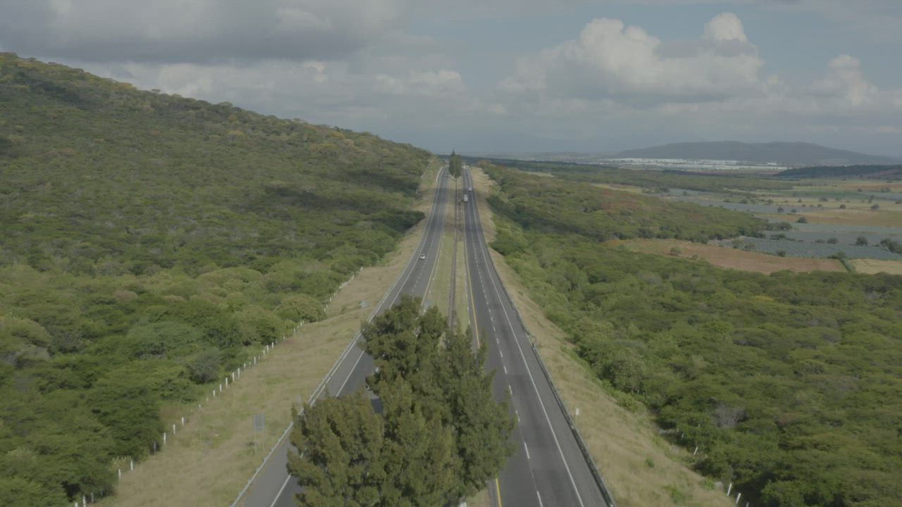 Double highway crossing nature in aerial shot - Free Stock Video