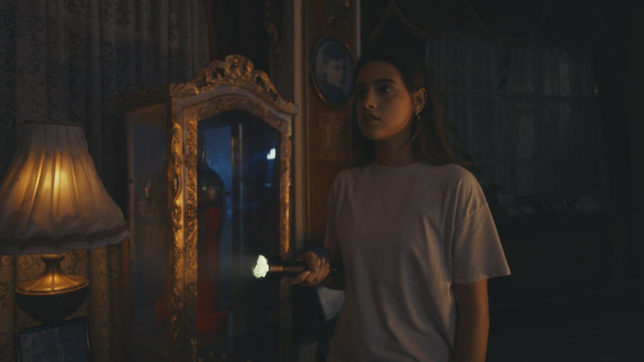 Scared young woman in a haunted house - Free Stock Video