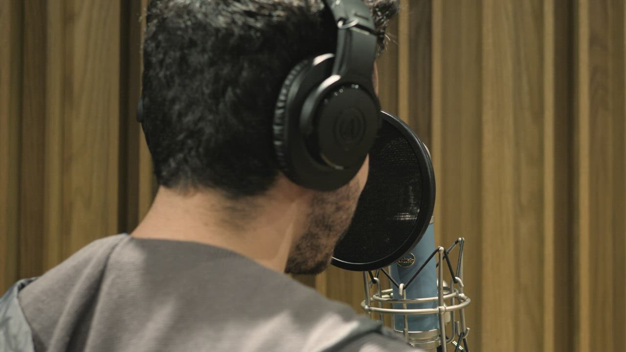 Man singing in a recording studio - Free Stock Video