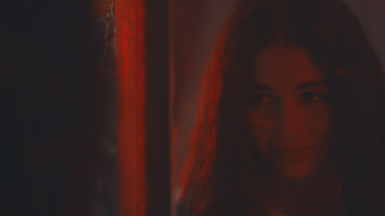 Face of a possessed girl smiling maliciously - Free Stock Video