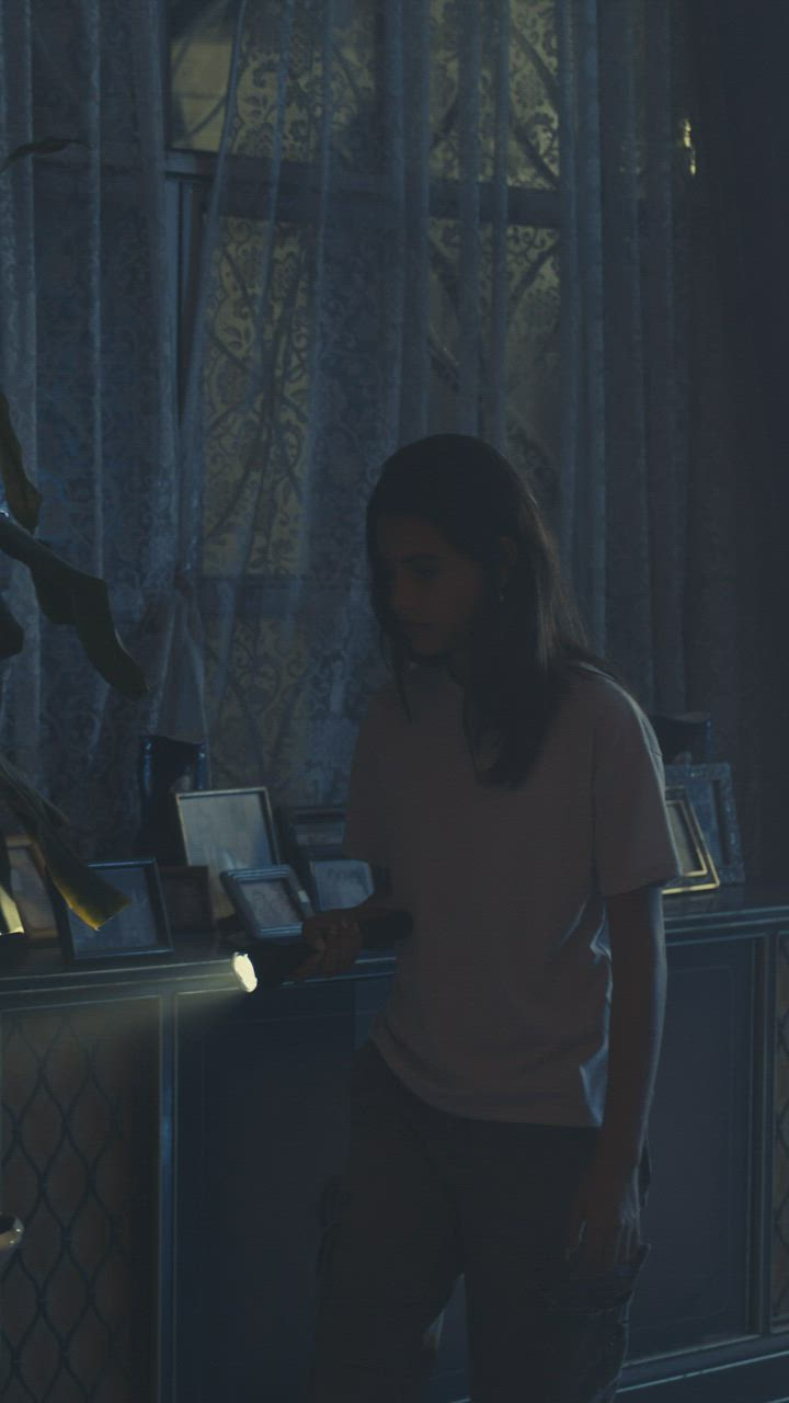Young woman exploring a haunted mansion - Free Stock Video